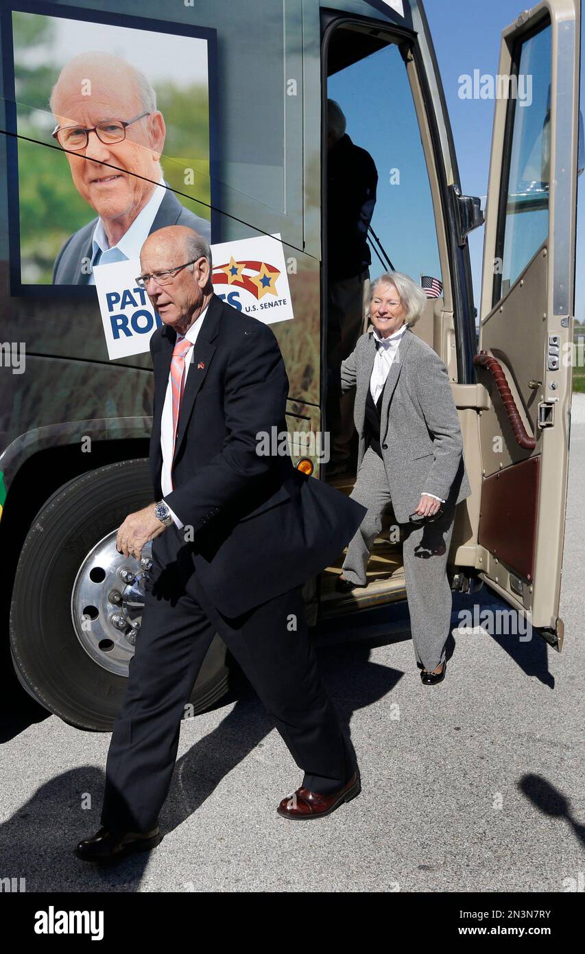 Sen. Pat Roberts, R-Kan., and wife Franki step off a bus for a campaign ...