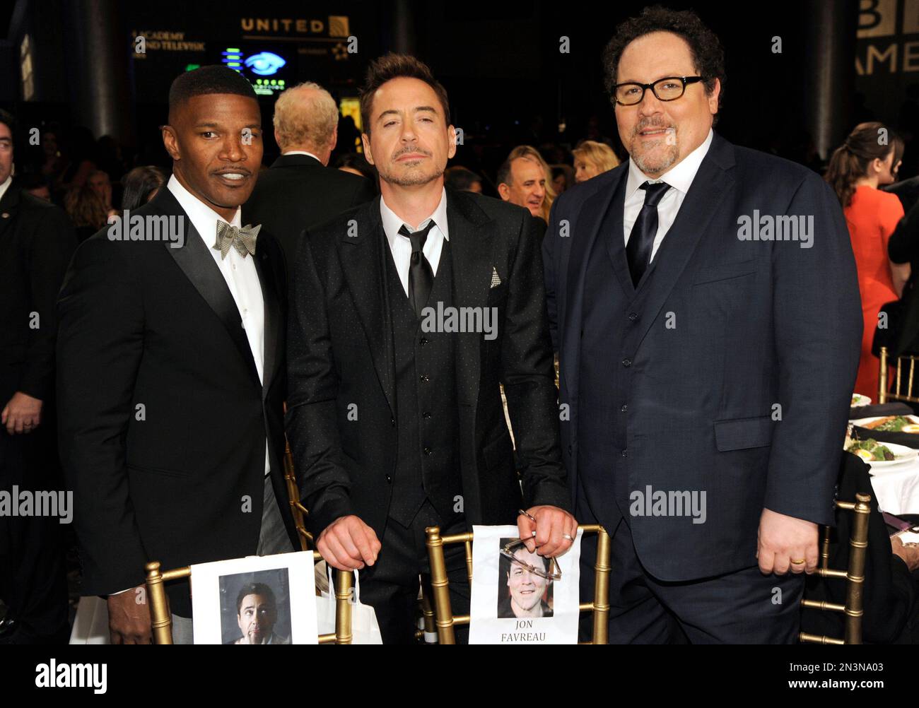 Jamie Foxx, from left, Robert Downey Jr. and Jon Favreau attend the ...