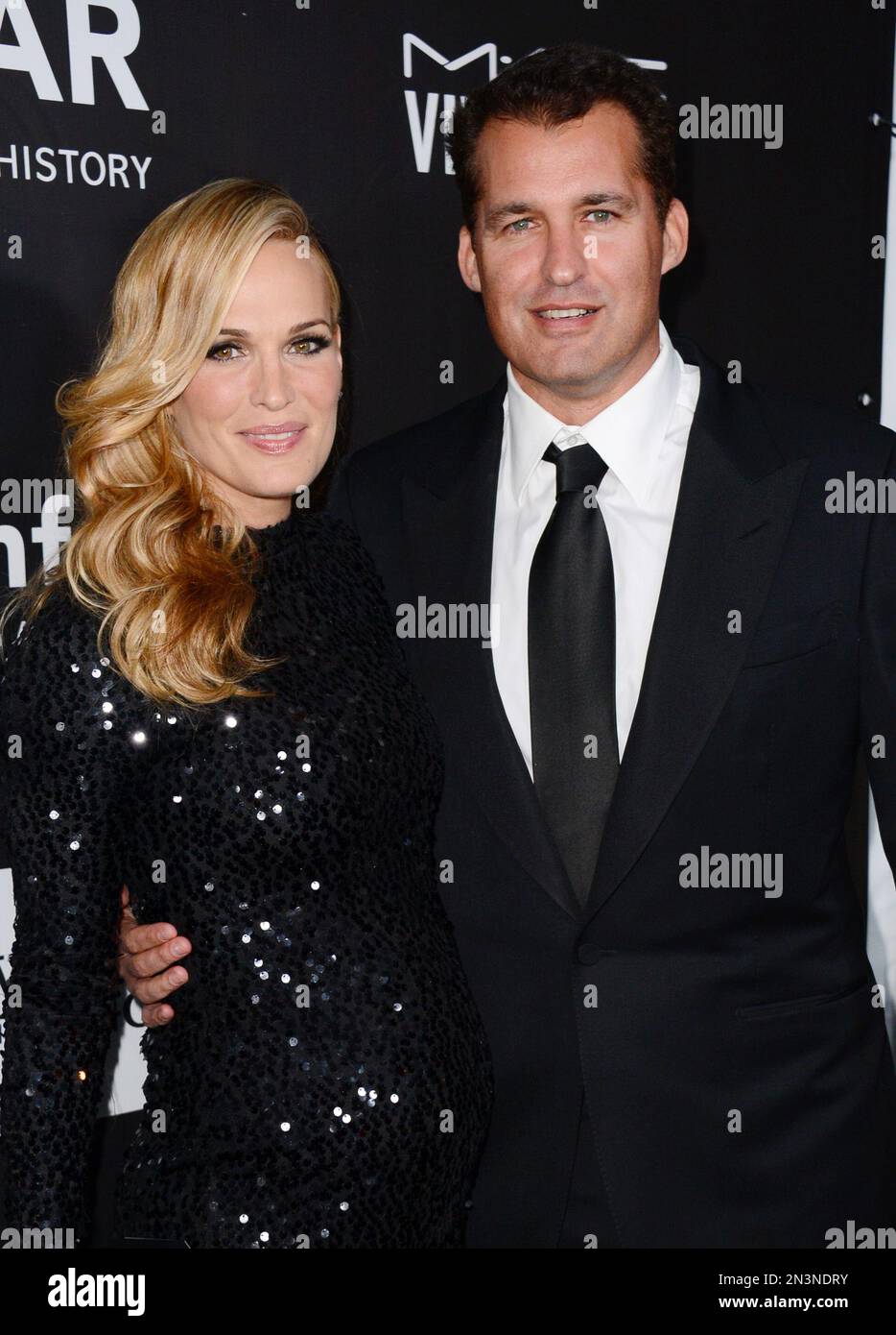 Molly Sims, left, and Scott Stuber arrive at the 2014 amfAR Inspiration ...