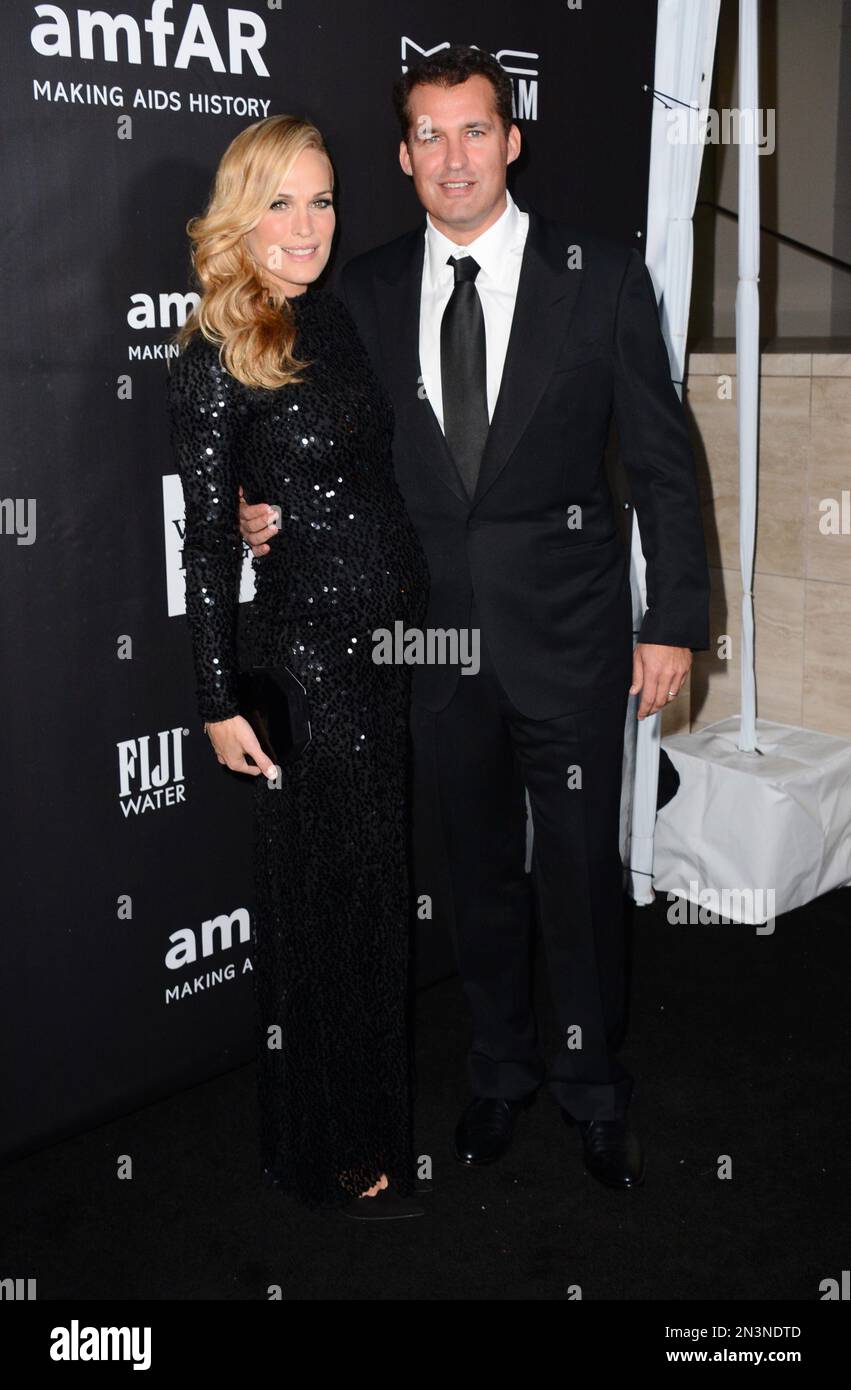 Molly Sims, left, and Scott Stuber arrive at the 2014 amfAR Inspiration ...