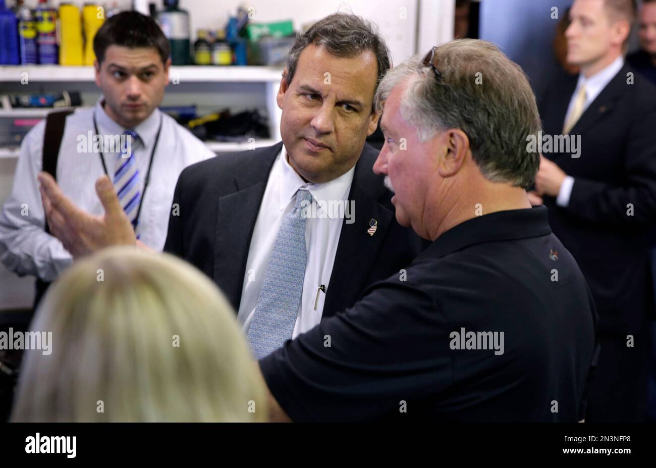 New Jersey Gov. Chris Christie, center, listens as Richard Weitzel ...