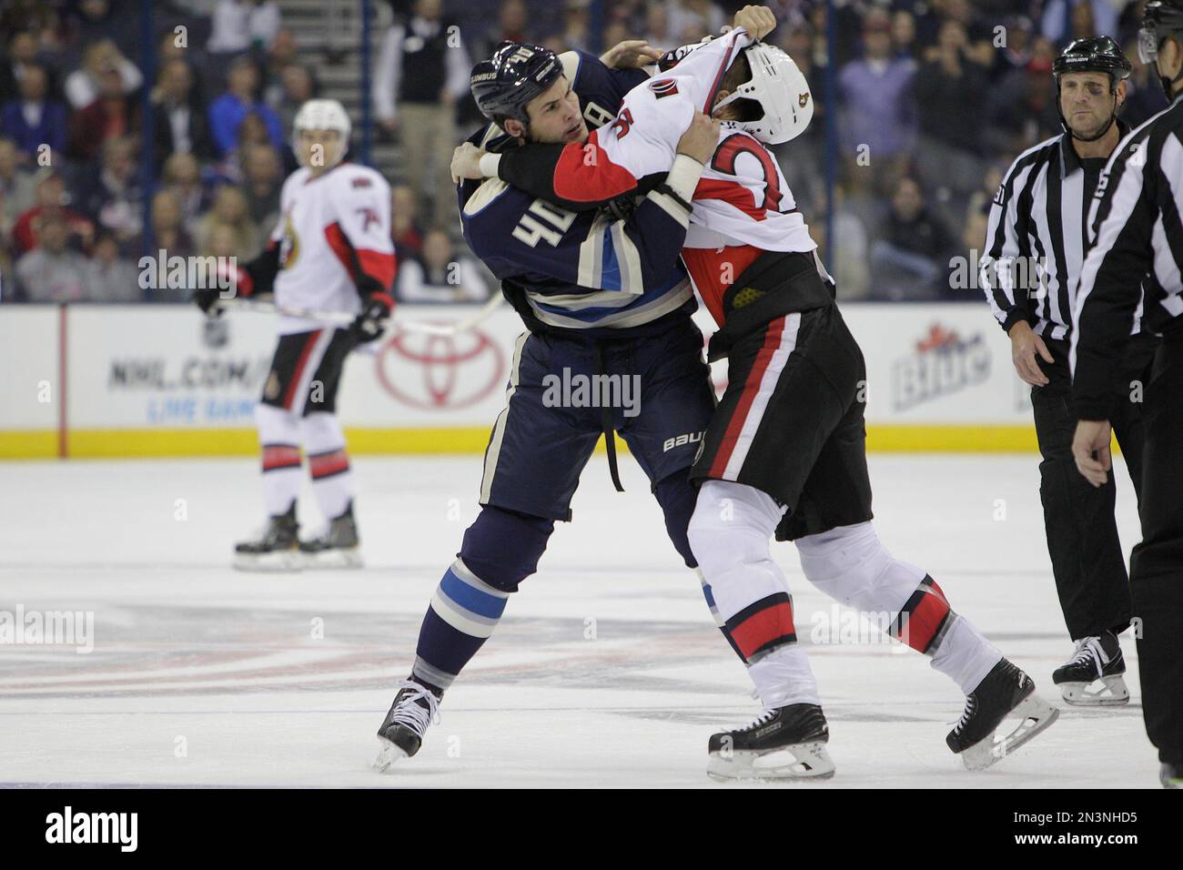 Ottawa Senators' Chris Neil, right, and Columbus Blue Jackets' Jared ...