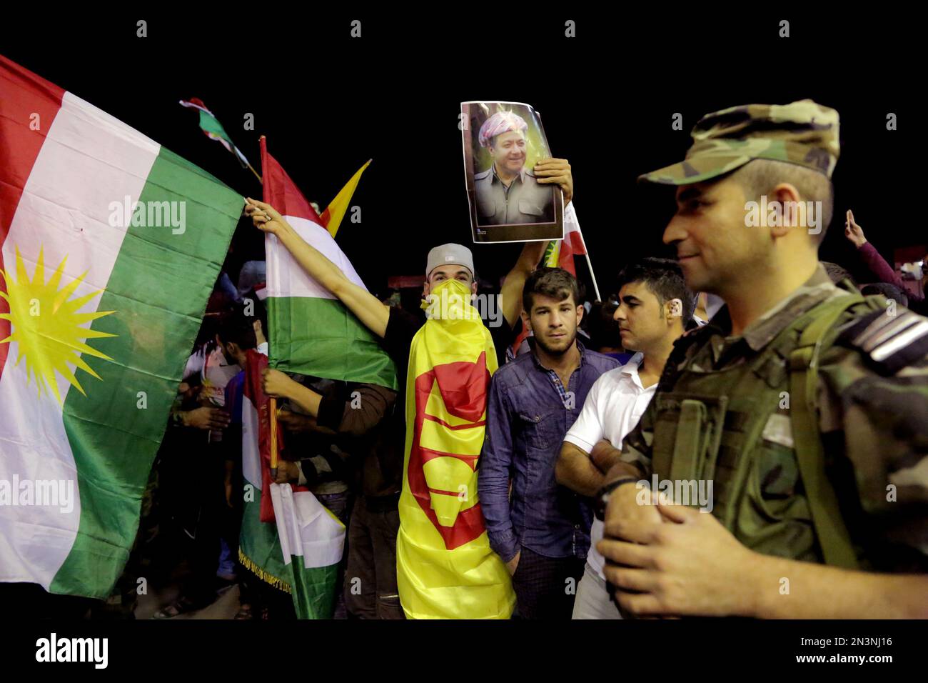 In this Tuesday, Oct. 28, 2014 photo, a supporter of Kurdish Peshmerga ...