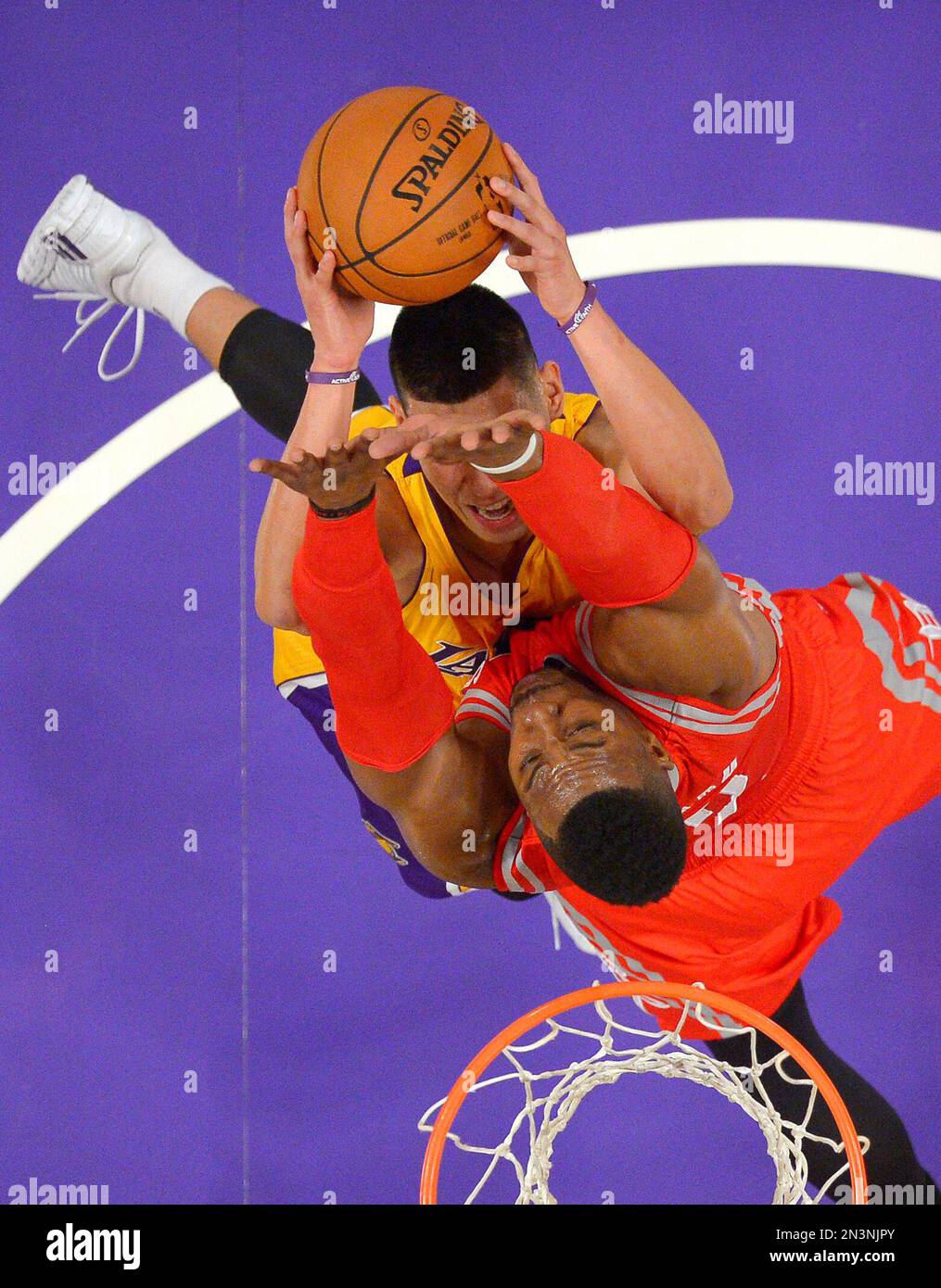 Los Angeles Lakers guard Jeremy Lin, top, goes up for a shot as Houston ...