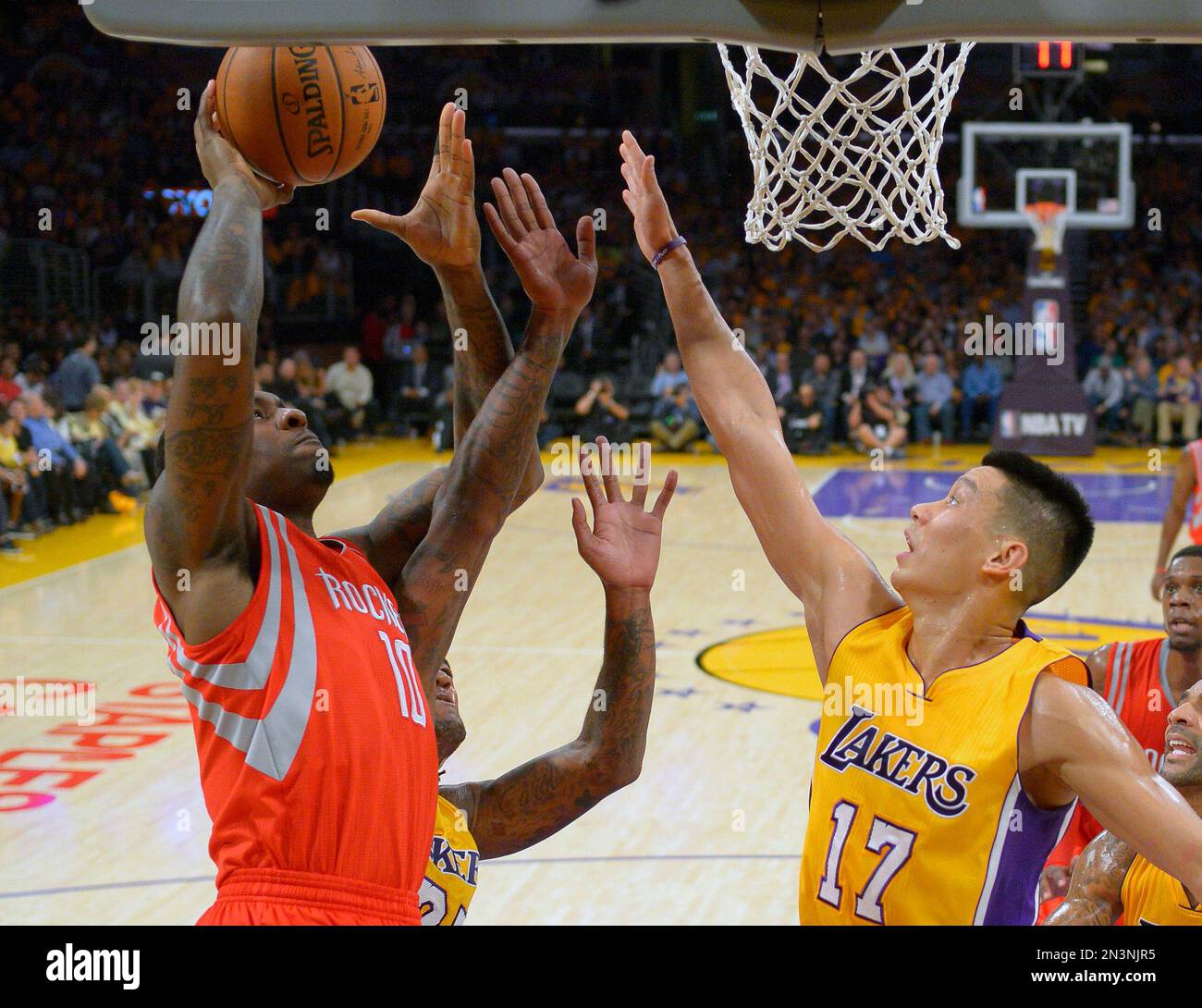 Houston Rockets forward Tarik Black, left, puts up a shot as Los ...
