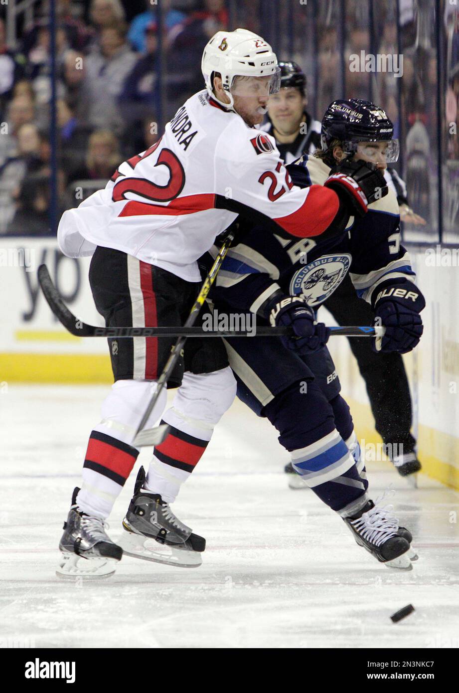 Ottawa Senators' Erik Condra, left, checks Columbus Blue Jackets' David ...