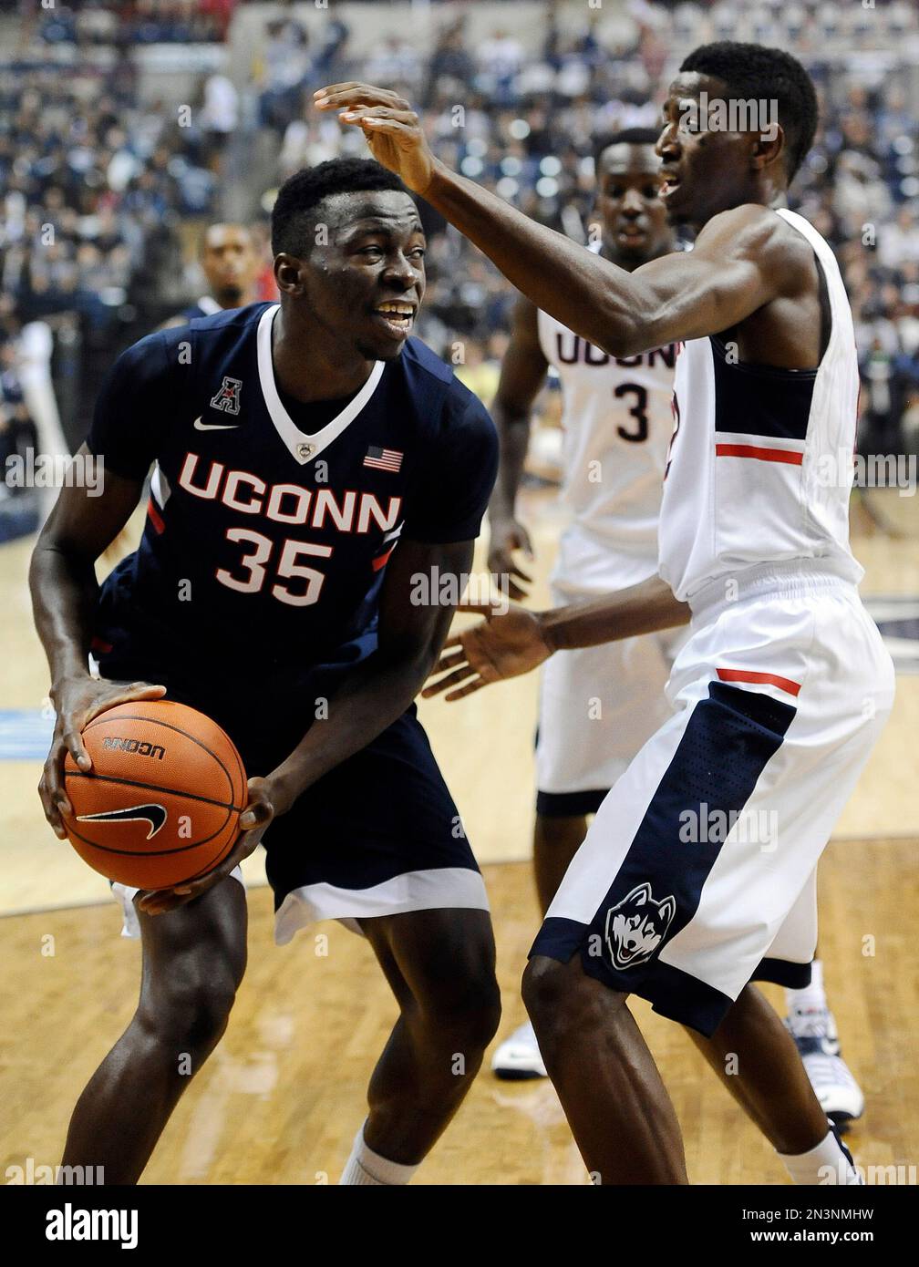 In this Oct. 17, 2014 photo, Connecticut's Kentan Facey, right, guards ...