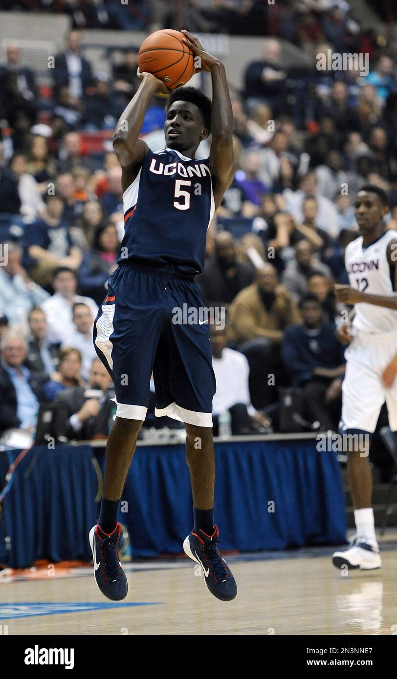In this Oct. 17, 2014 photo, Connecticut's Daniel Hamilton shoots at ...