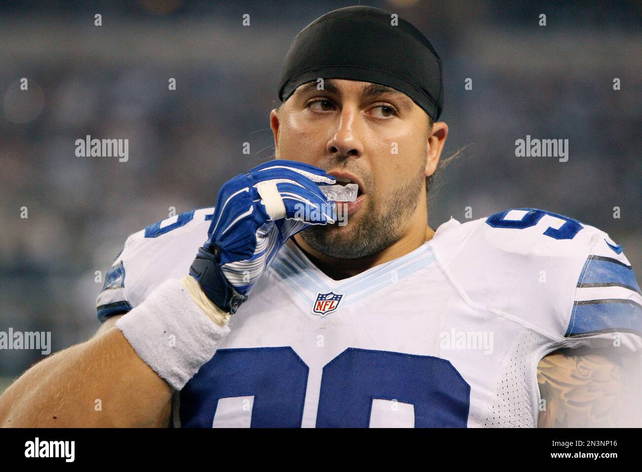 Dallas Cowboys defensive tackle Nick Hayden (96) inserts his mouthguard ...