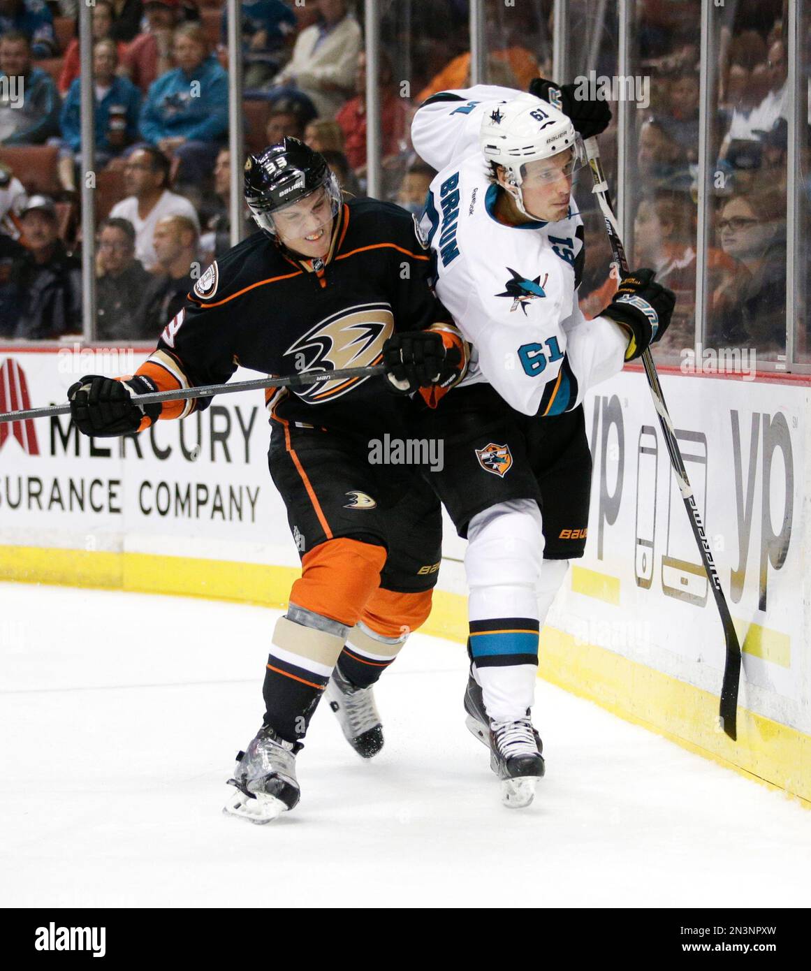 Anaheim Ducks' Jakob Silfverberg, left, checks San Jose Sharks' Justin ...