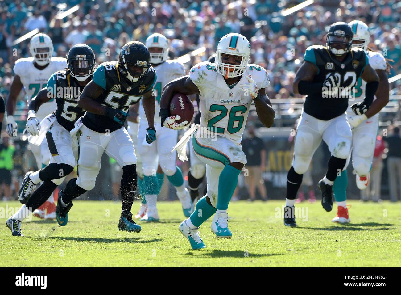 Miami Dolphins running back Lamar Miller (26) breaks free for a 30-yard ...