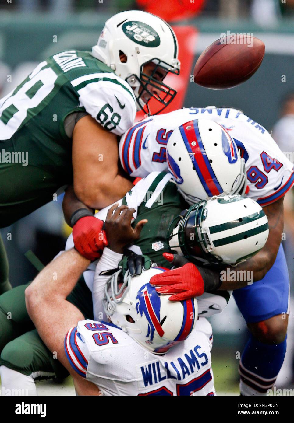 New York Jets quarterback Michael Vick (1) is sacked by Buffalo Bills ...