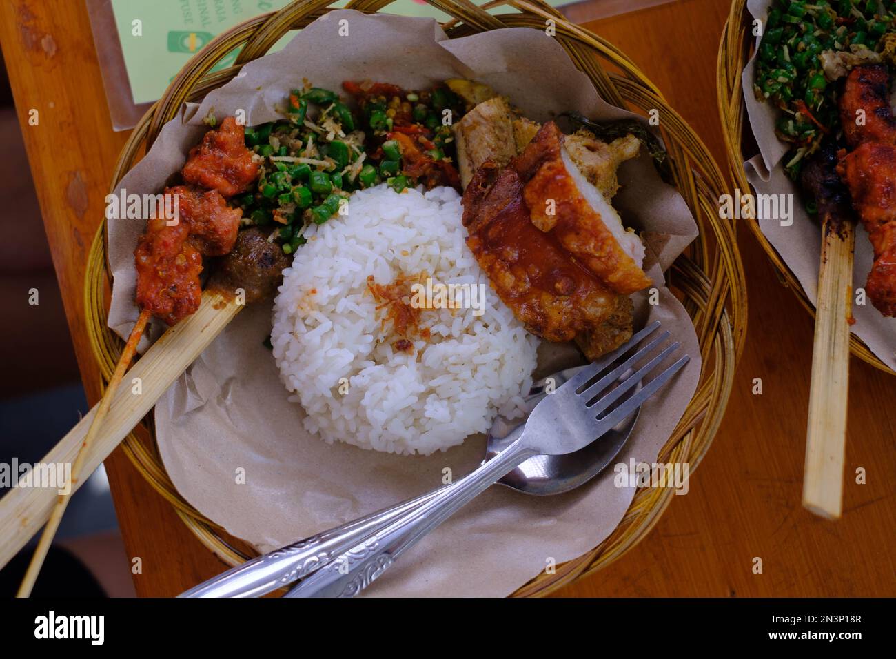 Delicious Suckling Pig Served on a Rattan Plate with Rice. Flat lay. A ...