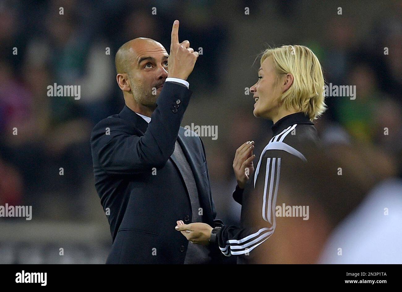 Bayern's head coach Pep Guardiola complains to the assistant referee ...