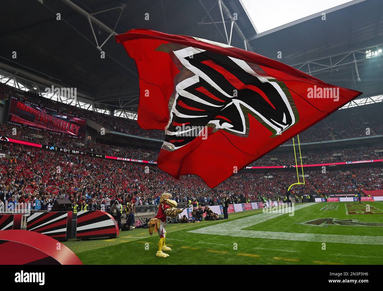 Atlanta Falcons mascot waves a flag as he runs onto the field before ...
