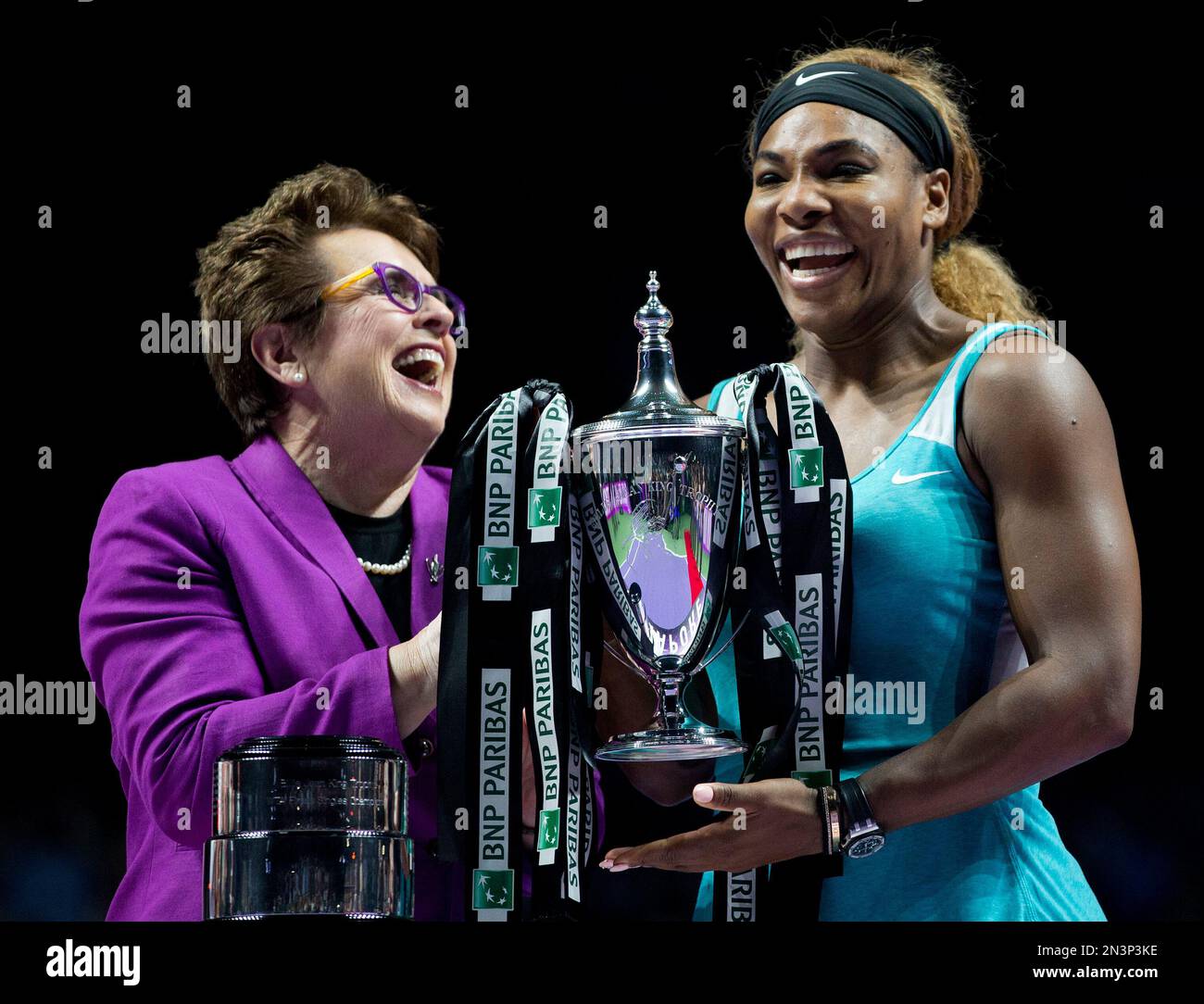Serena Williams, right, of the U.S. receives her trophy from former champion Billie Jean King ...