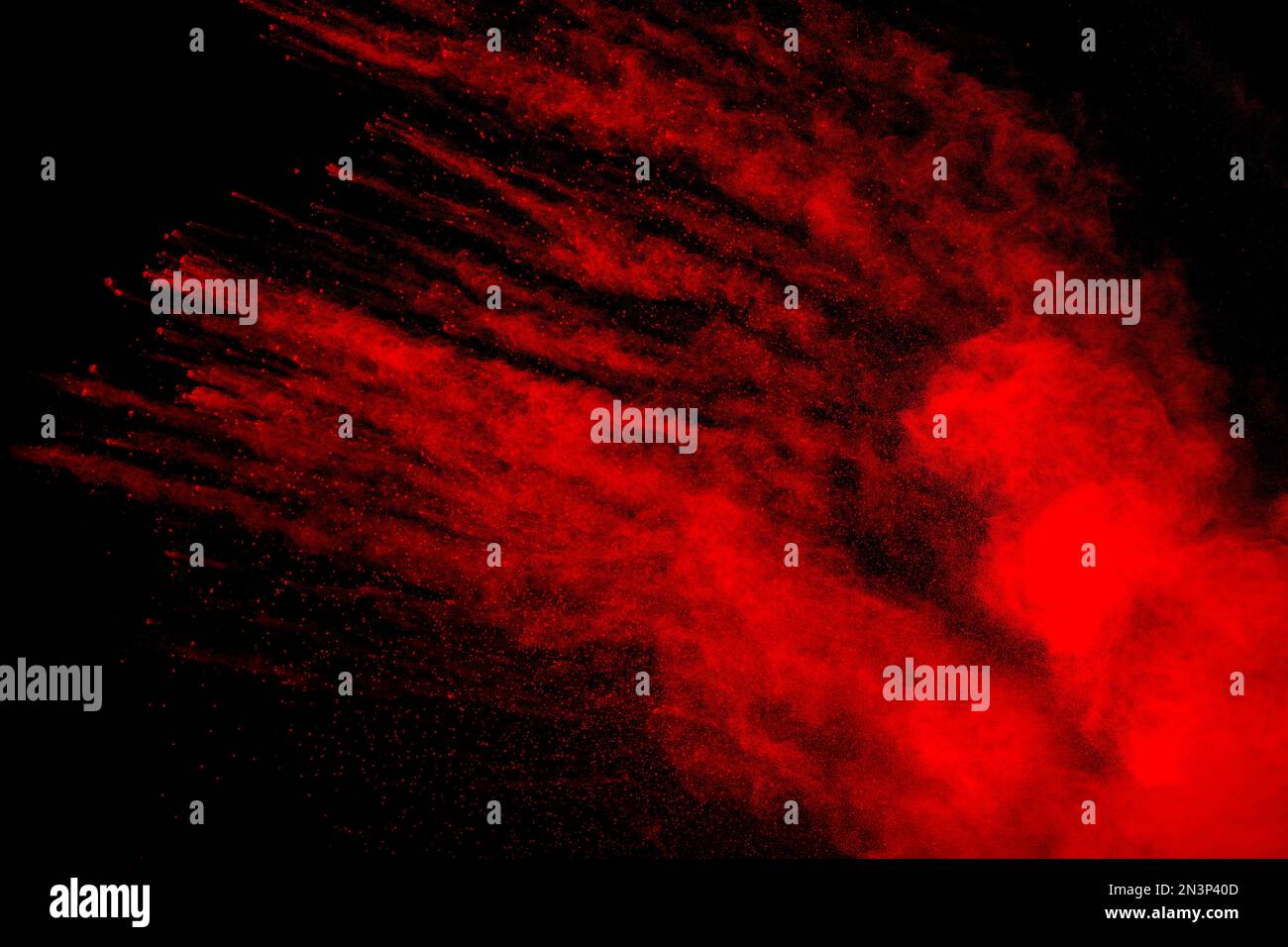 Red powder explosion cloud on black background. Freeze motion of red ...