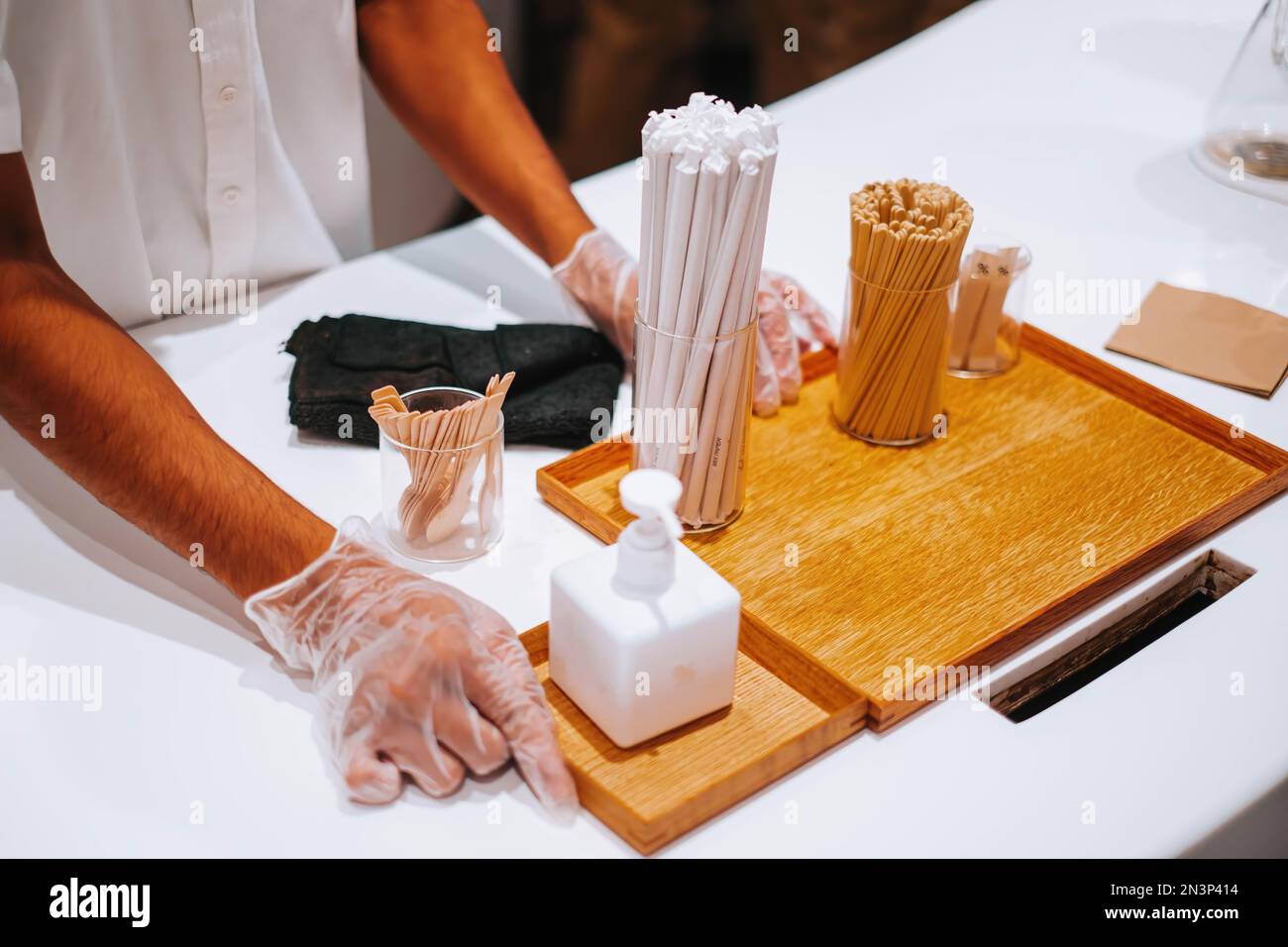 A minimalist photo of a wooden tray filled with glass of drinking ...