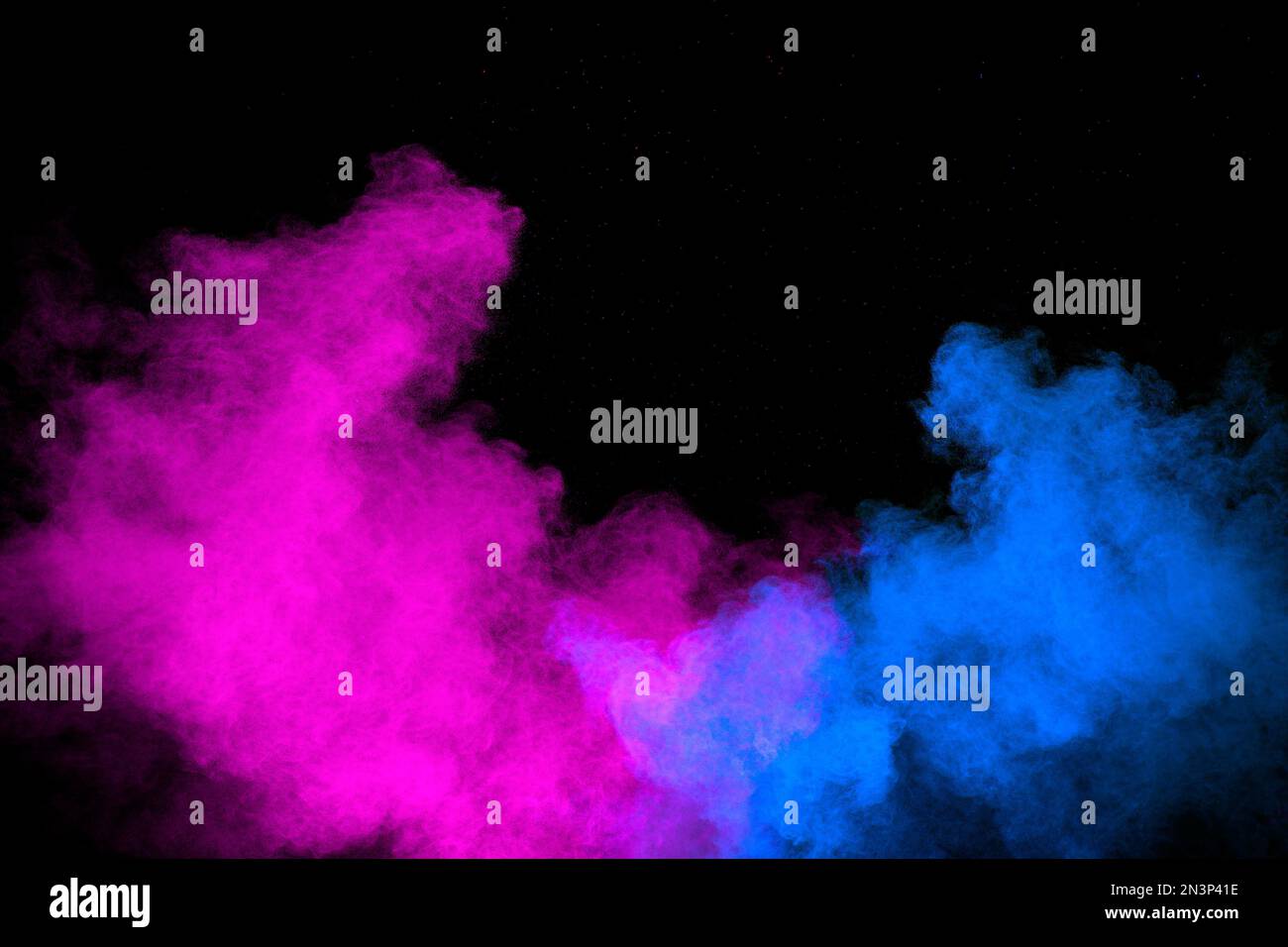 Blue pink color powder explosion on black background Stock Photo - Alamy