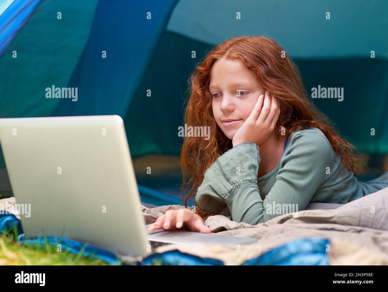Shes got internet freedom in the wilderness. Portrait of a young girl ...