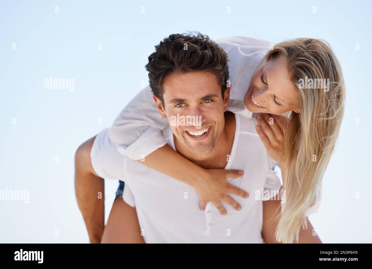 Excited about the sunshine. A handsome young boyfriend giving his ...