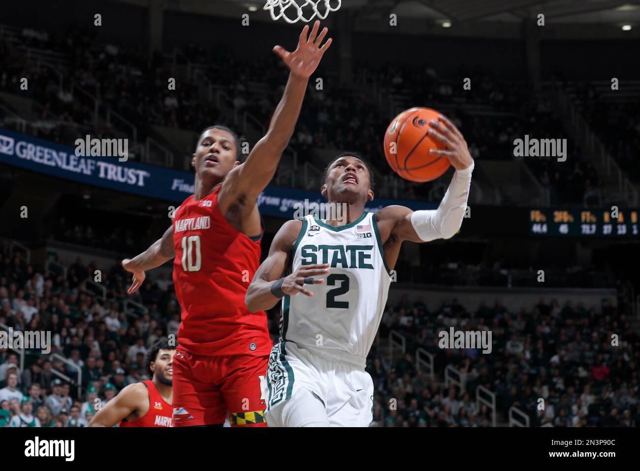 Michigan State's Tyson Walker, right, shoots against Maryland's Julian ...