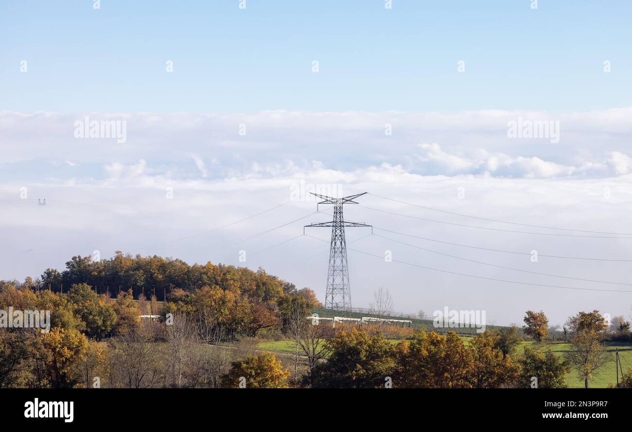 Farm Lands on top of a hill overlooking landscape covered in clouds ...