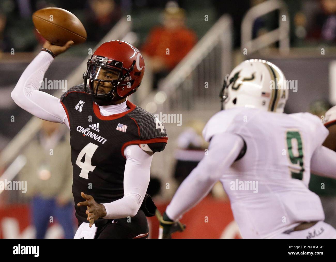 Cincinnati quarterback Munchie Legaux (4) passes against South Florida ...