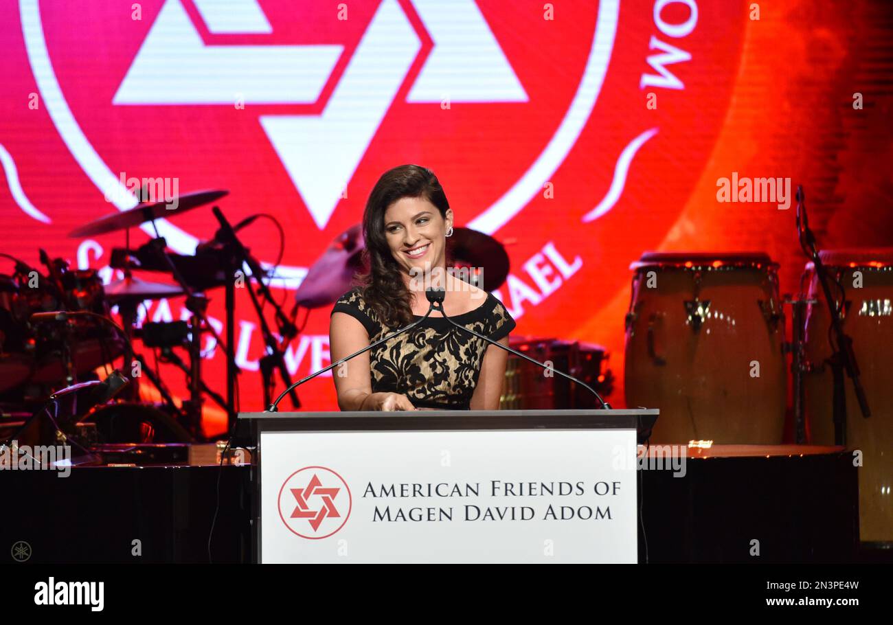 Gina Edwards accepts the Next Generation Award on stage at American ...