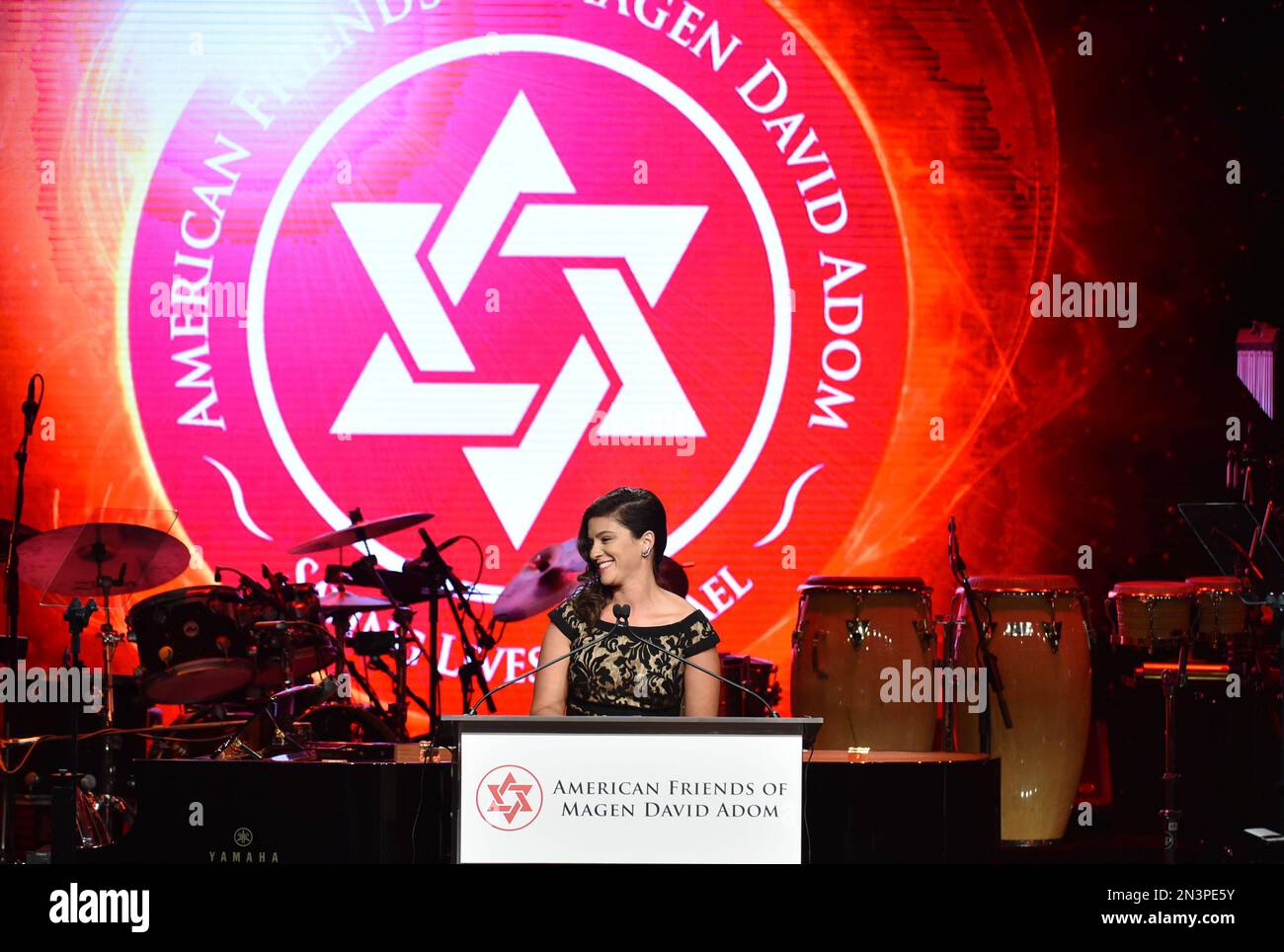 Gina Edwards accepts the Next Generation Award on stage at American ...