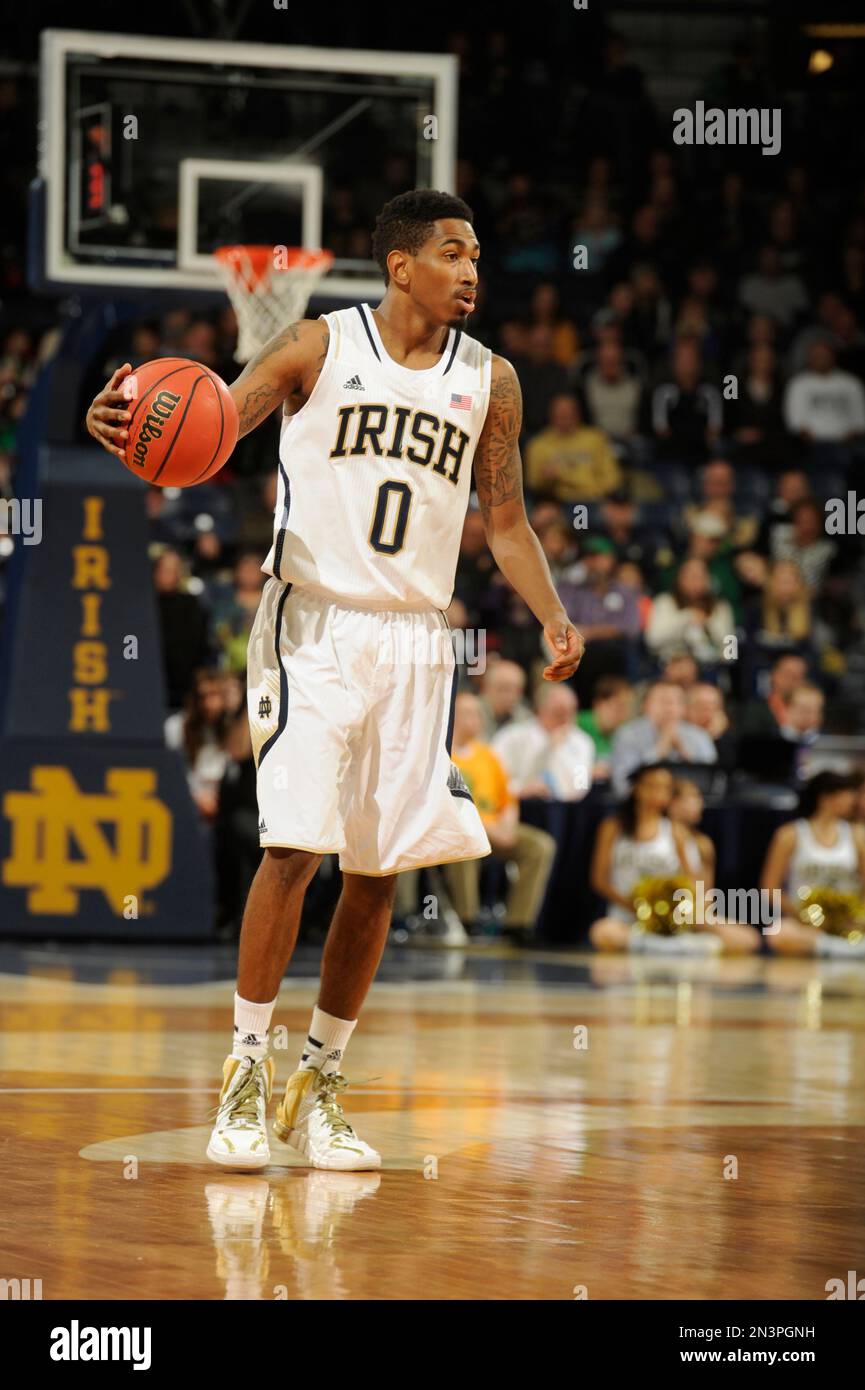 Notre Dame guard Eric Atkins heads up court during action in a college ...