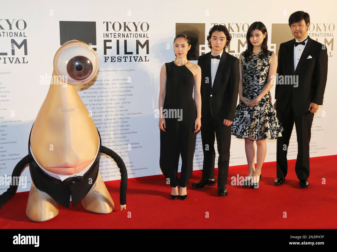 Japanese film director Takashi Yamazaki, right, and actors, from left ...