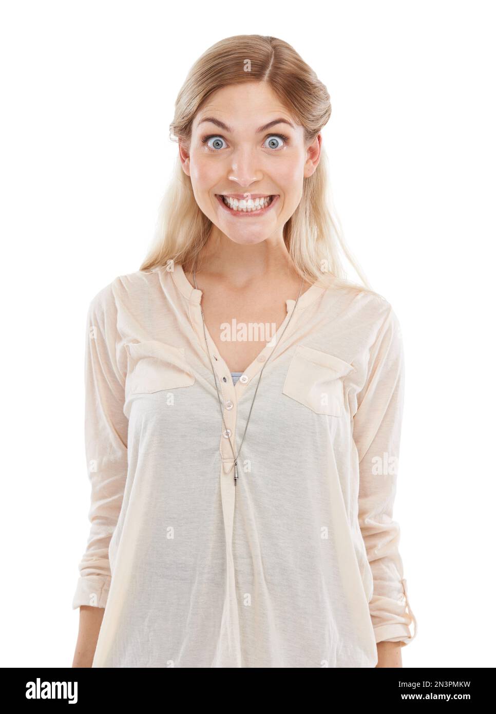 Im so excited. A young woman smiling broadly with wide eyes against a ...