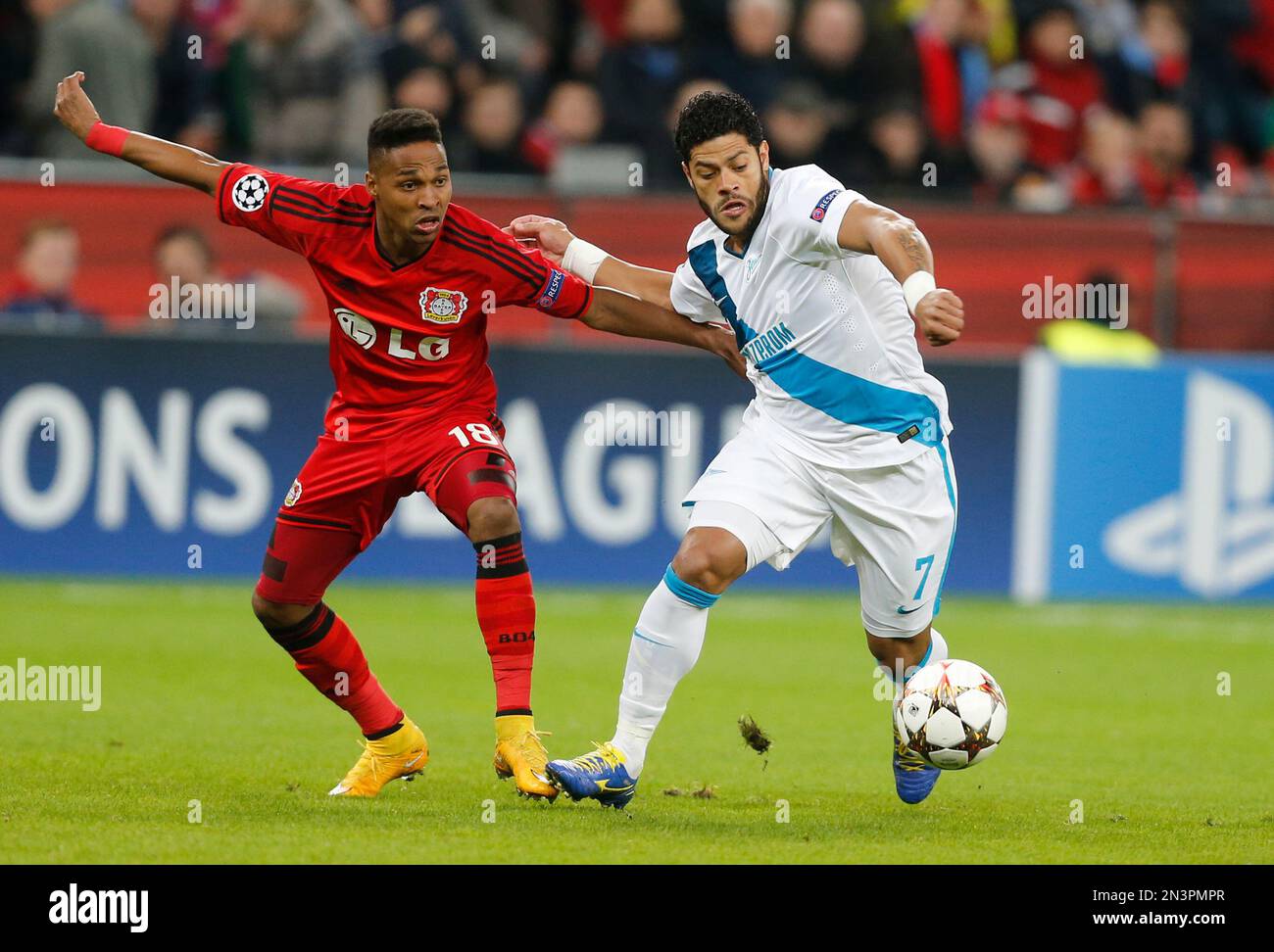Leverkusen's Wendell, left, and Zenit's Hulk challenge for the ball ...