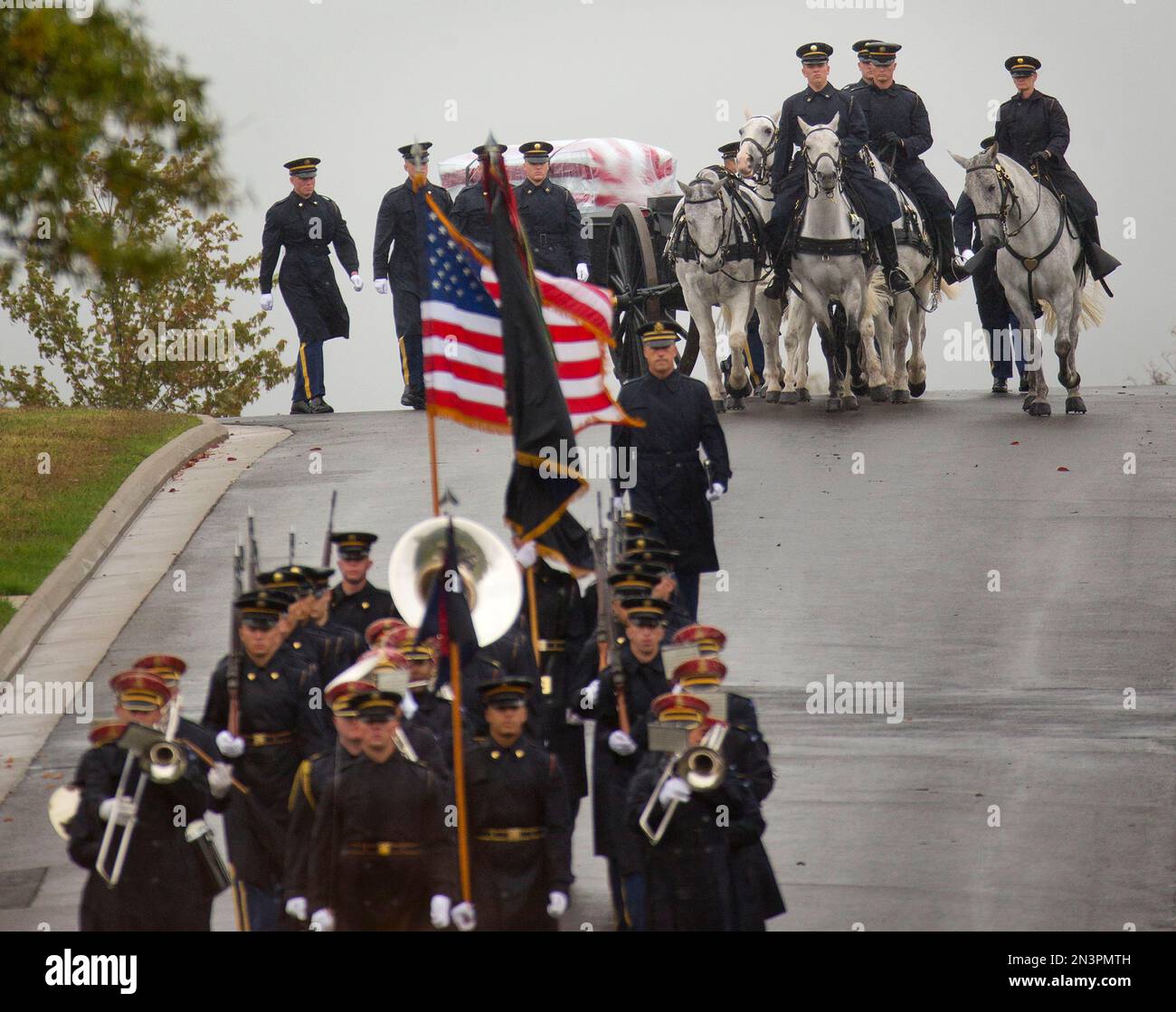 A caisson with the coffin containing the remains of WWII Army Pfc ...