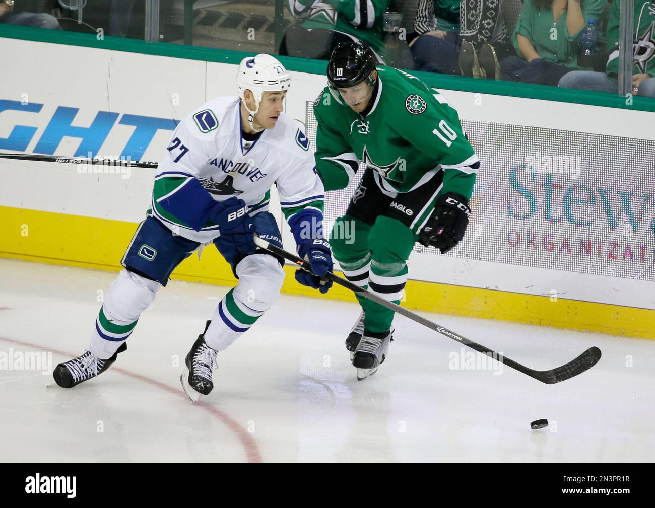 Vancouver Canucks' Shawn Matthias (27) handles the puck in front of ...