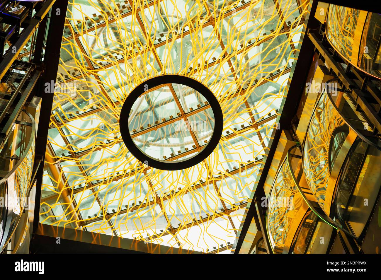 Glass roof atrium, construction and elevator shaft in modern building ...