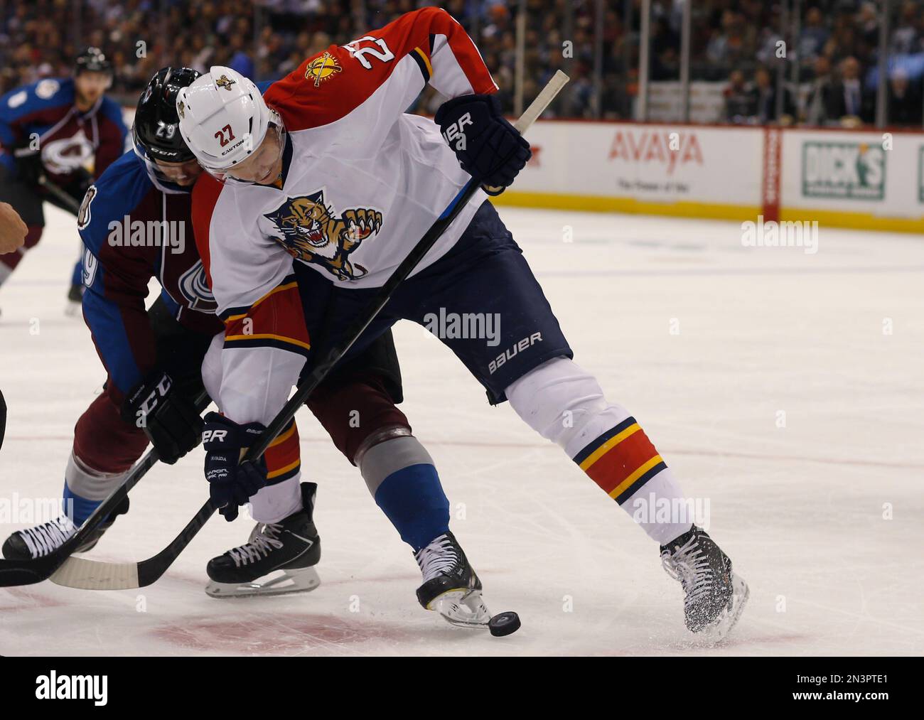 Florida Panthers center Nick Bjugstad, front, checks Colorado Avalanche ...