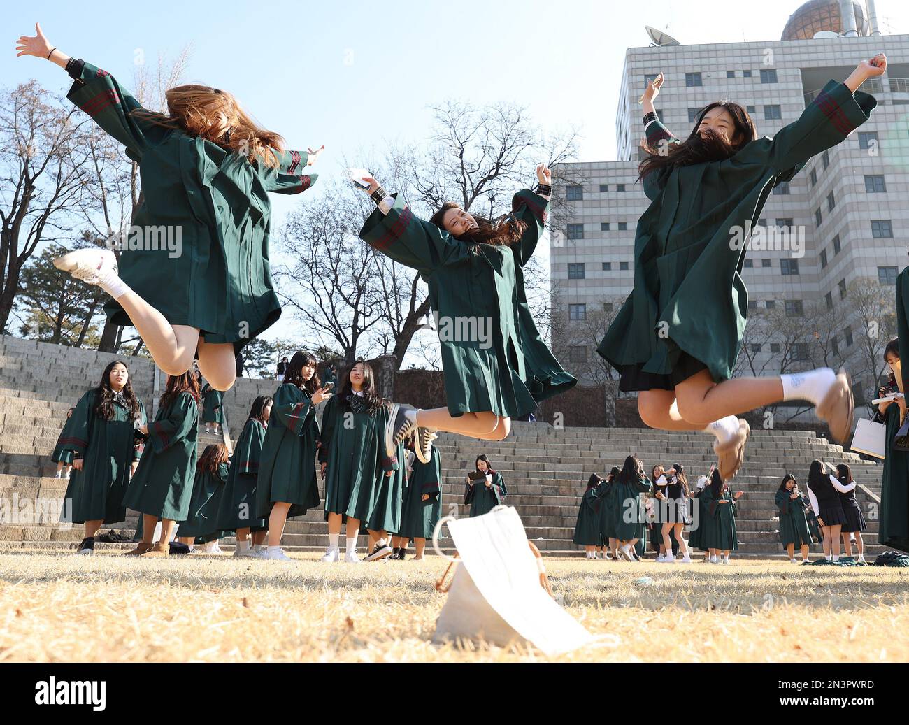 08th Feb, 2023. Graduation A group of senior students in borrowed gowns ...