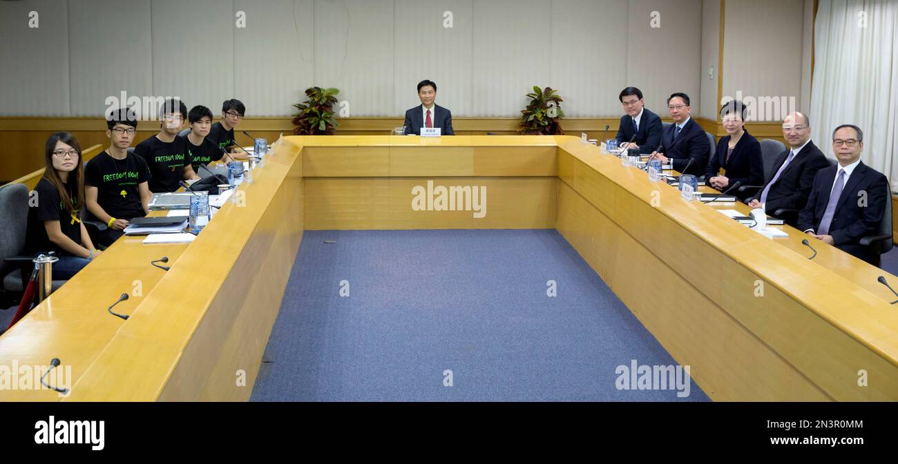 Hong Kong government officials, from right, the Constitutional and ...