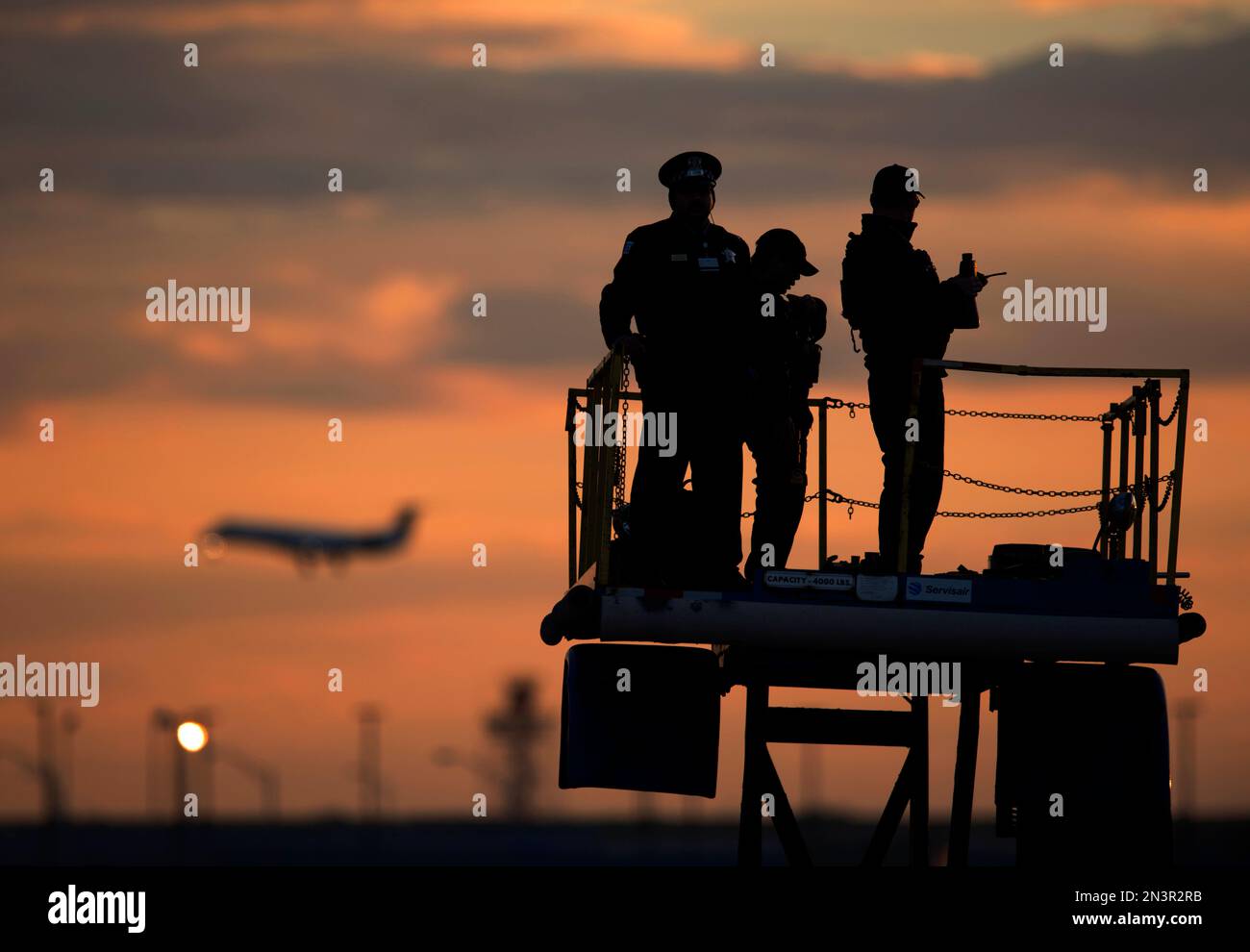Members of the secret service and Chicago police officers keep watch ...