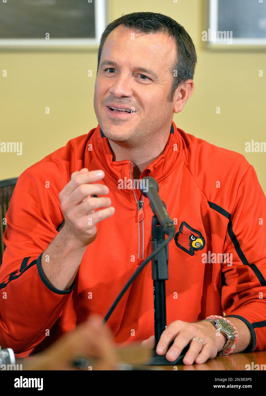 Louisville women's head basketball coach Jeff Walz reacts to a question ...