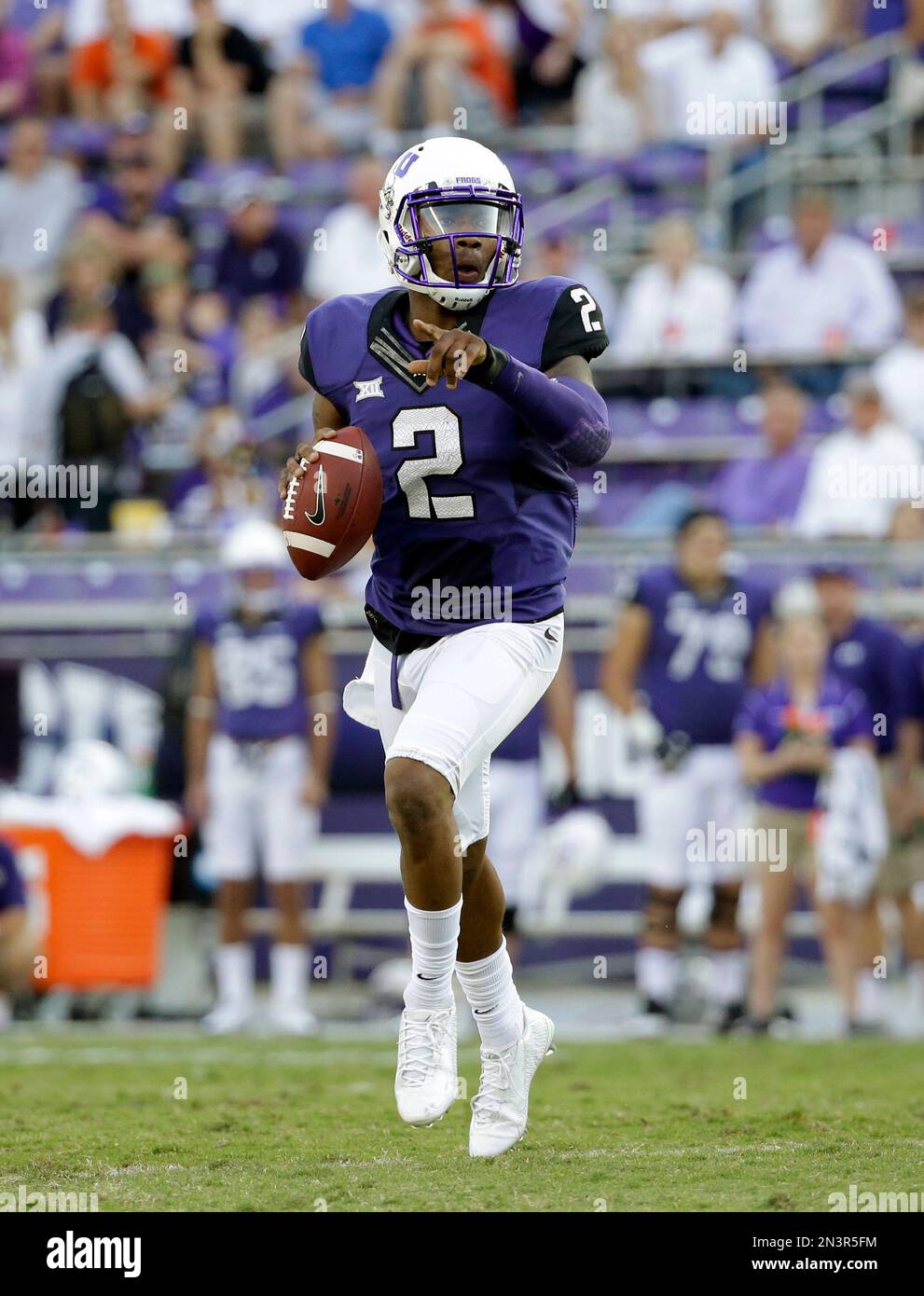 TCU quarterback Trevone Boykin (2) scrambles out of the pocket ...