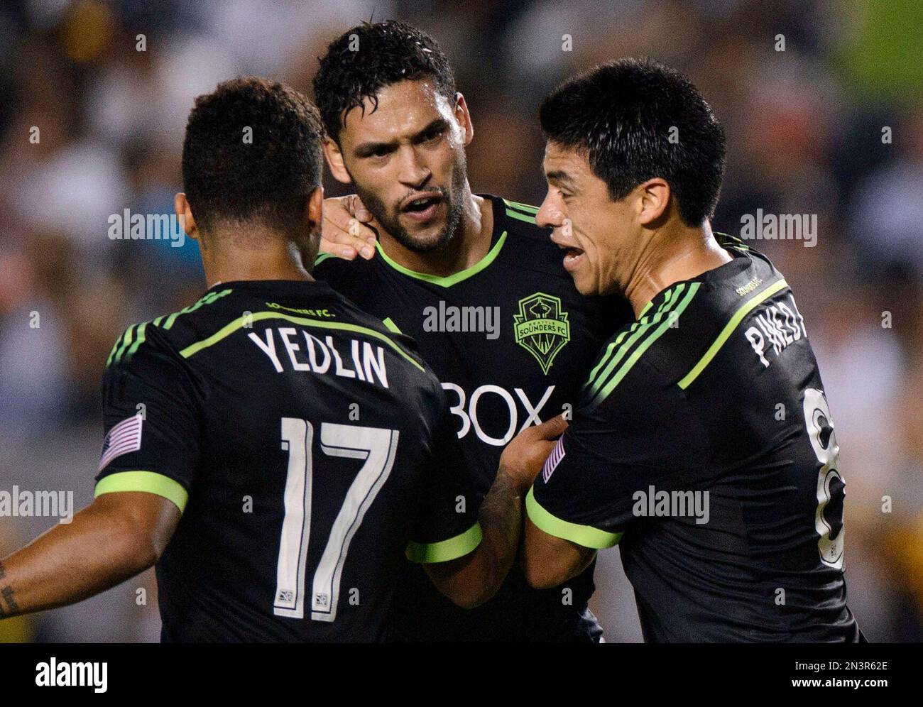 Seattle Sounders midfielder Lamar Neagle, center, celebrates with ...