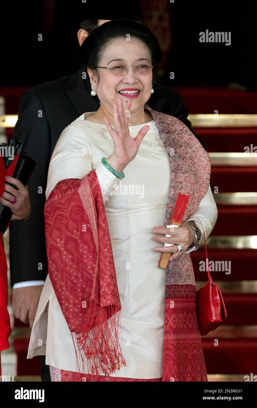 Former Indonesian President Megawati Sukarnoputri waves as she arrives ...