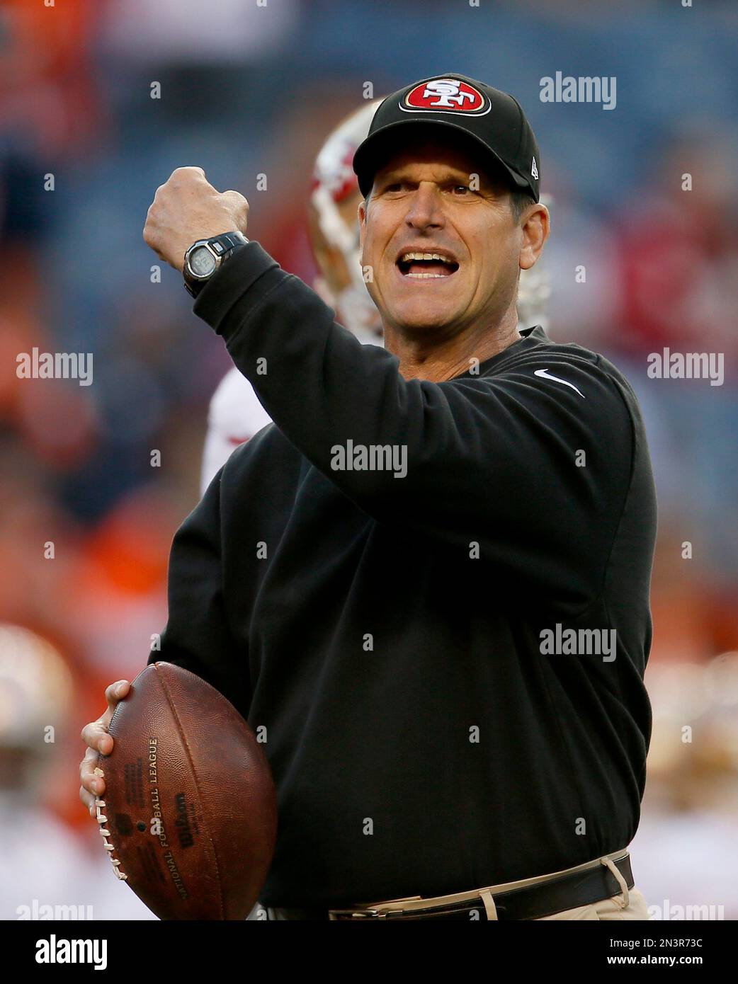 San Francisco 49ers head coach Jim Harbaugh warms up his team prior to ...