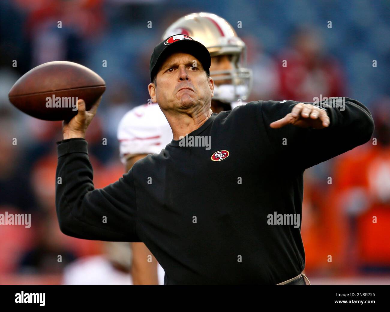 San Francisco 49ers head coach Jim Harbaugh warms up his team prior to ...