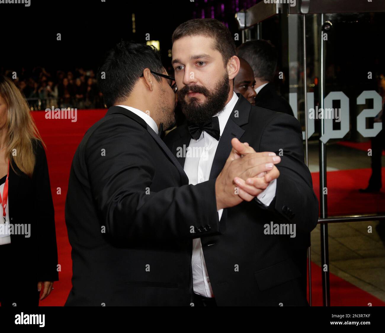 Actors Shia LaBeouf, right, dances with Michael Pena, at the premiere ...
