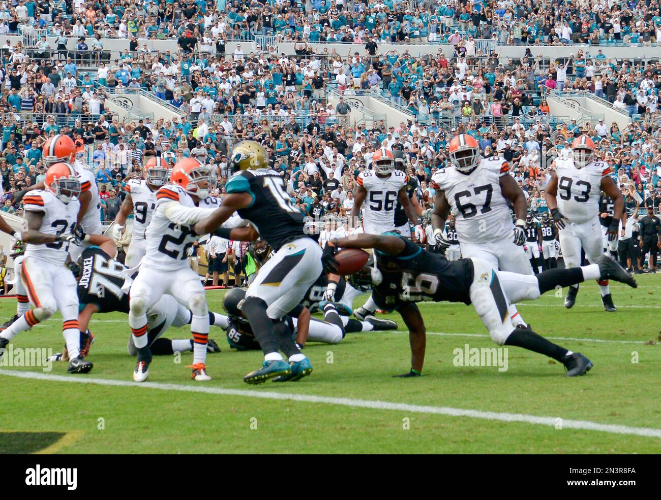 Jacksonville Jaguars running back Denard Robinson (16) dives over the ...