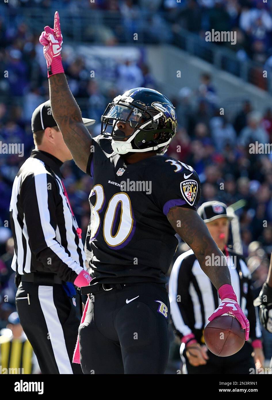 Baltimore Ravens running back Bernard Pierce reacts after falling into ...